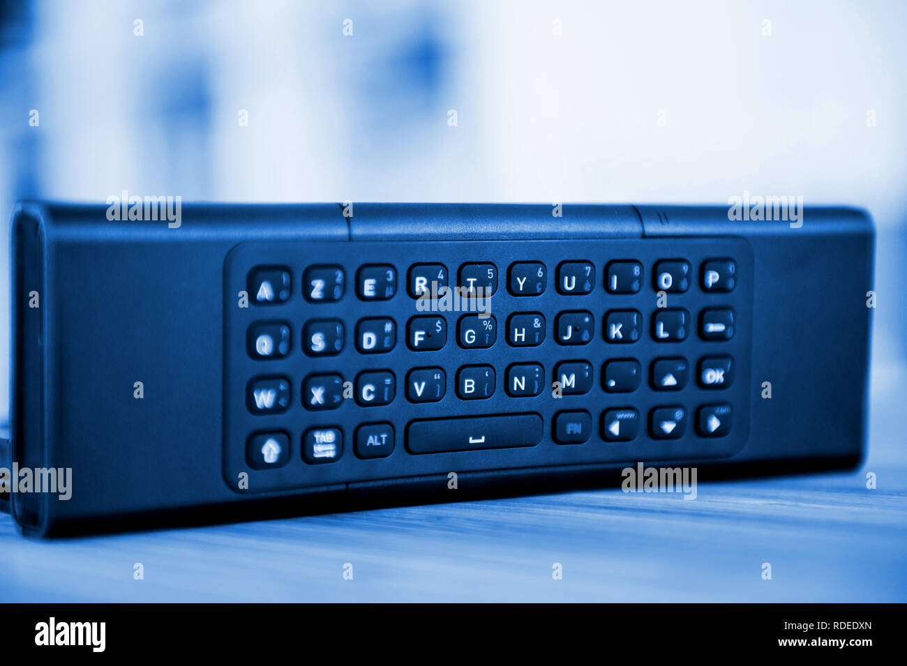 Blue color toned chromacity of full keyboard modern remote control for ...