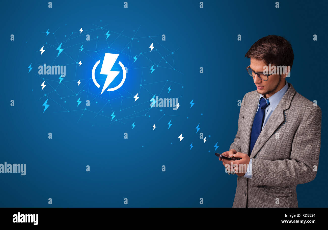 Young person using phone with power concept Stock Photo - Alamy