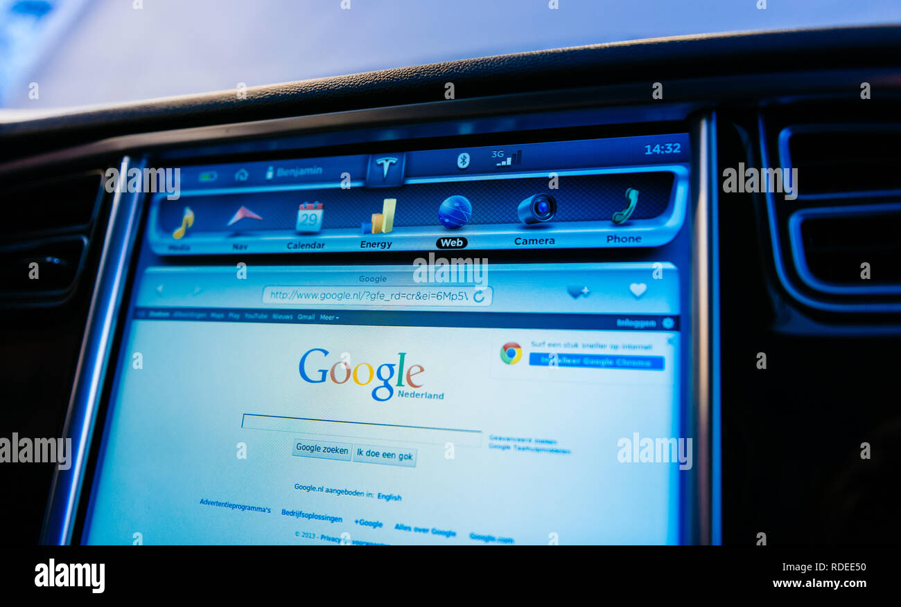 PARIS, FRANCE - NOV 29, 2014: Blue toned Tesla Model S dashboard ...