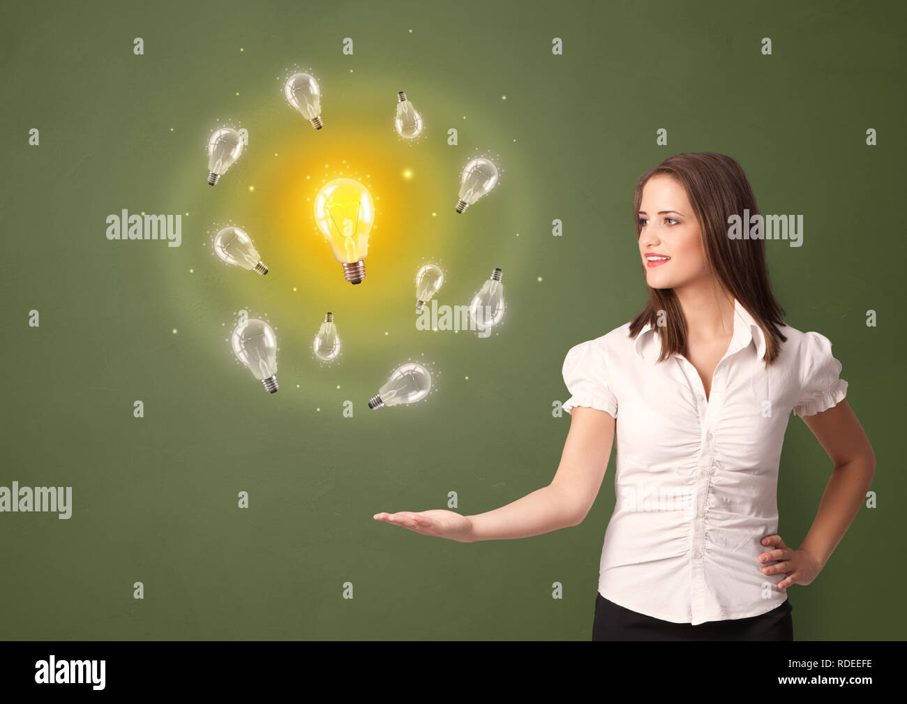 Young smiling person presenting new idea concept Stock Photo - Alamy