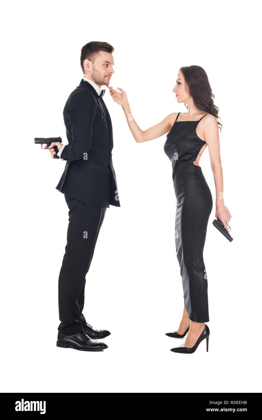 together couple of killers in black clothes holding guns, isolated on ...