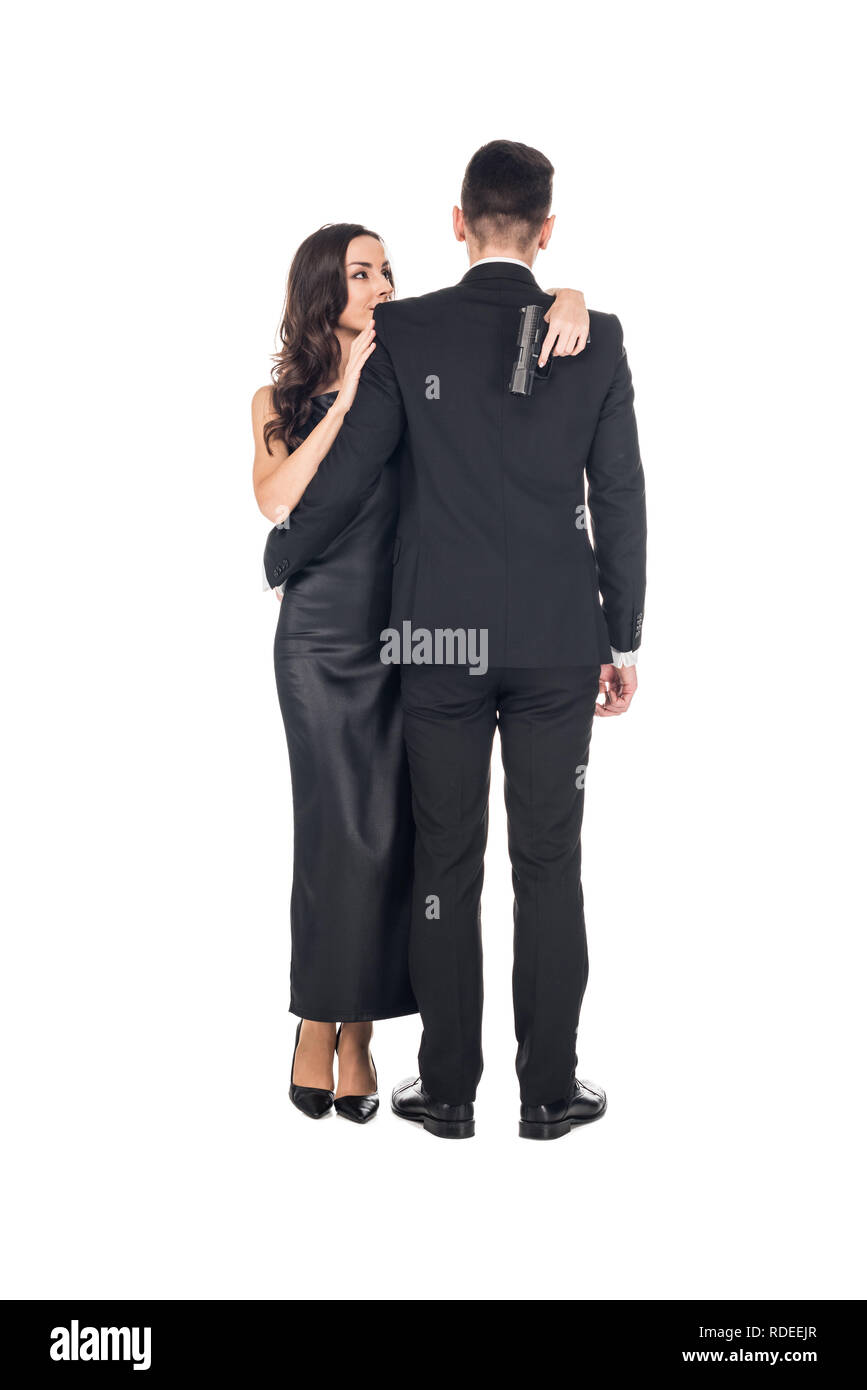 beautiful elegant couple of secret agents embracing and holding gun ...