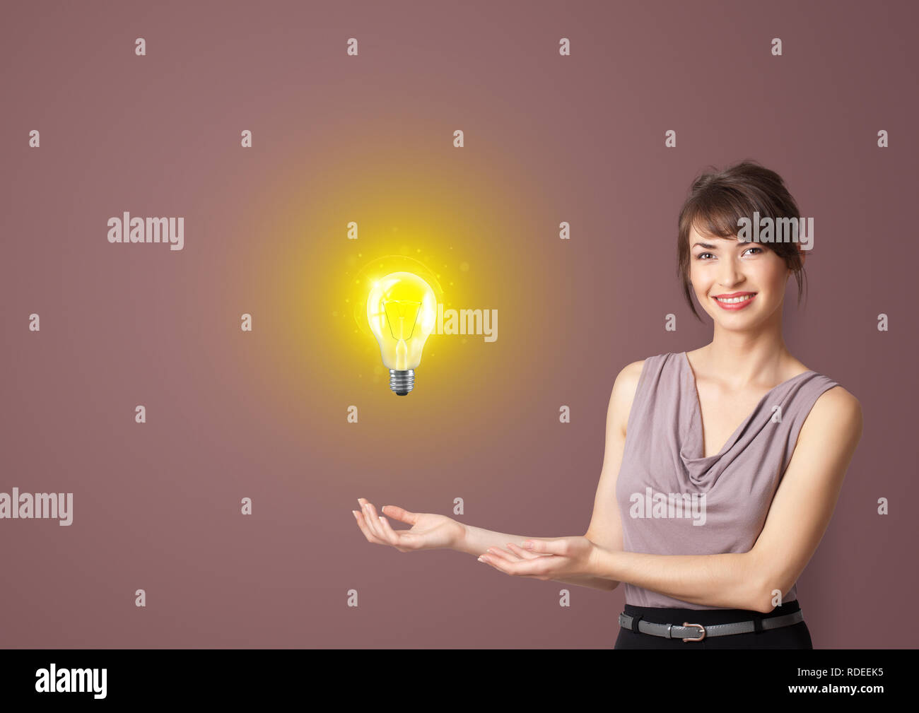 Young smiling person presenting new idea concept Stock Photo - Alamy