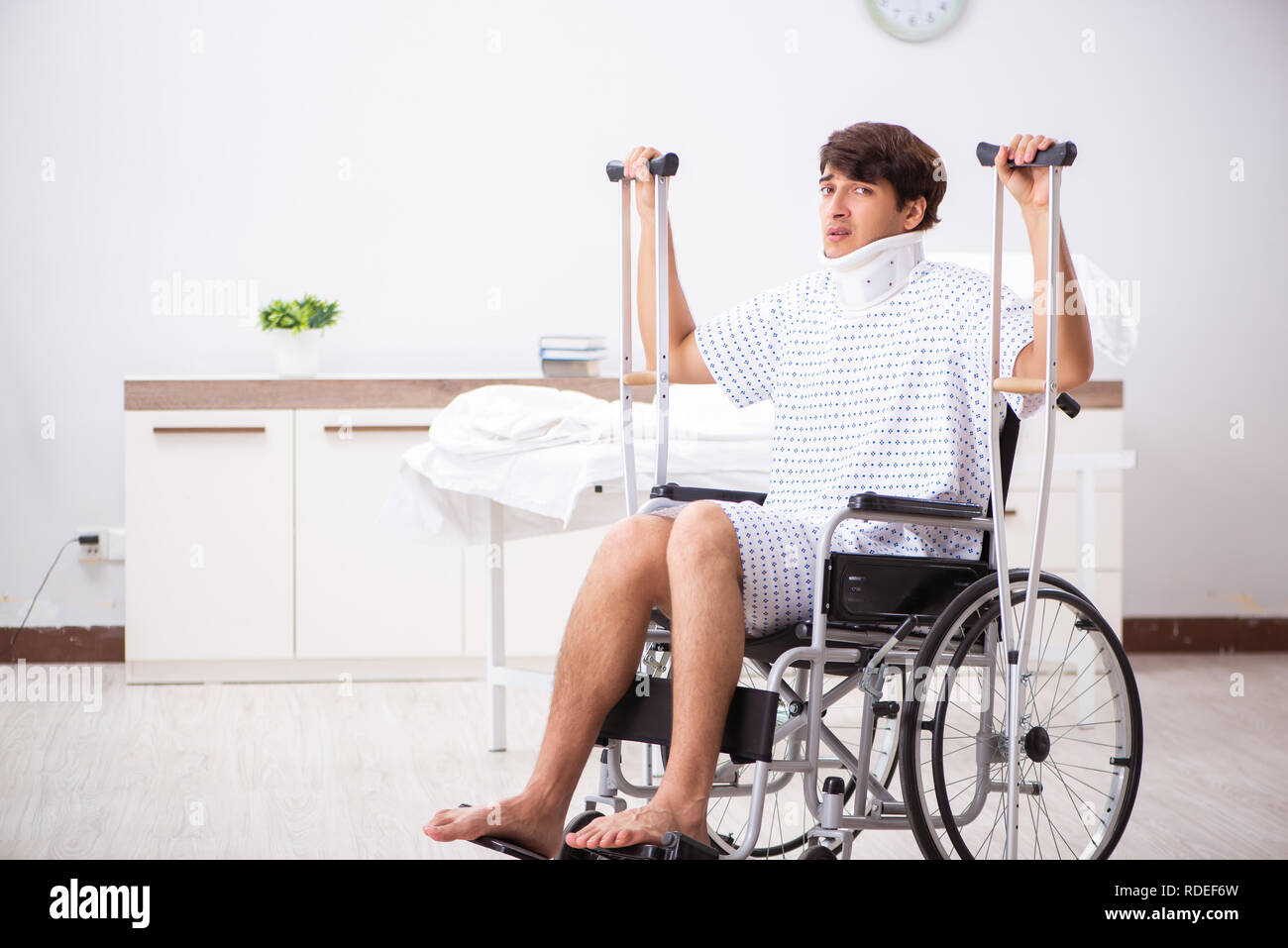 Young handsome man in wheelchair at the hospital Stock Photo - Alamy