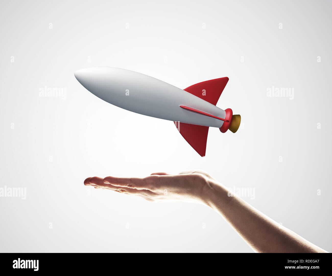 Rocket in hand as symbol for high technologies and science Stock Photo ...