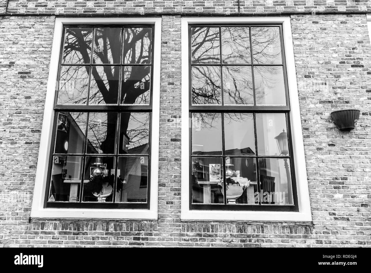Reflections in old fashioned traditional window in Amsterdam, The ...