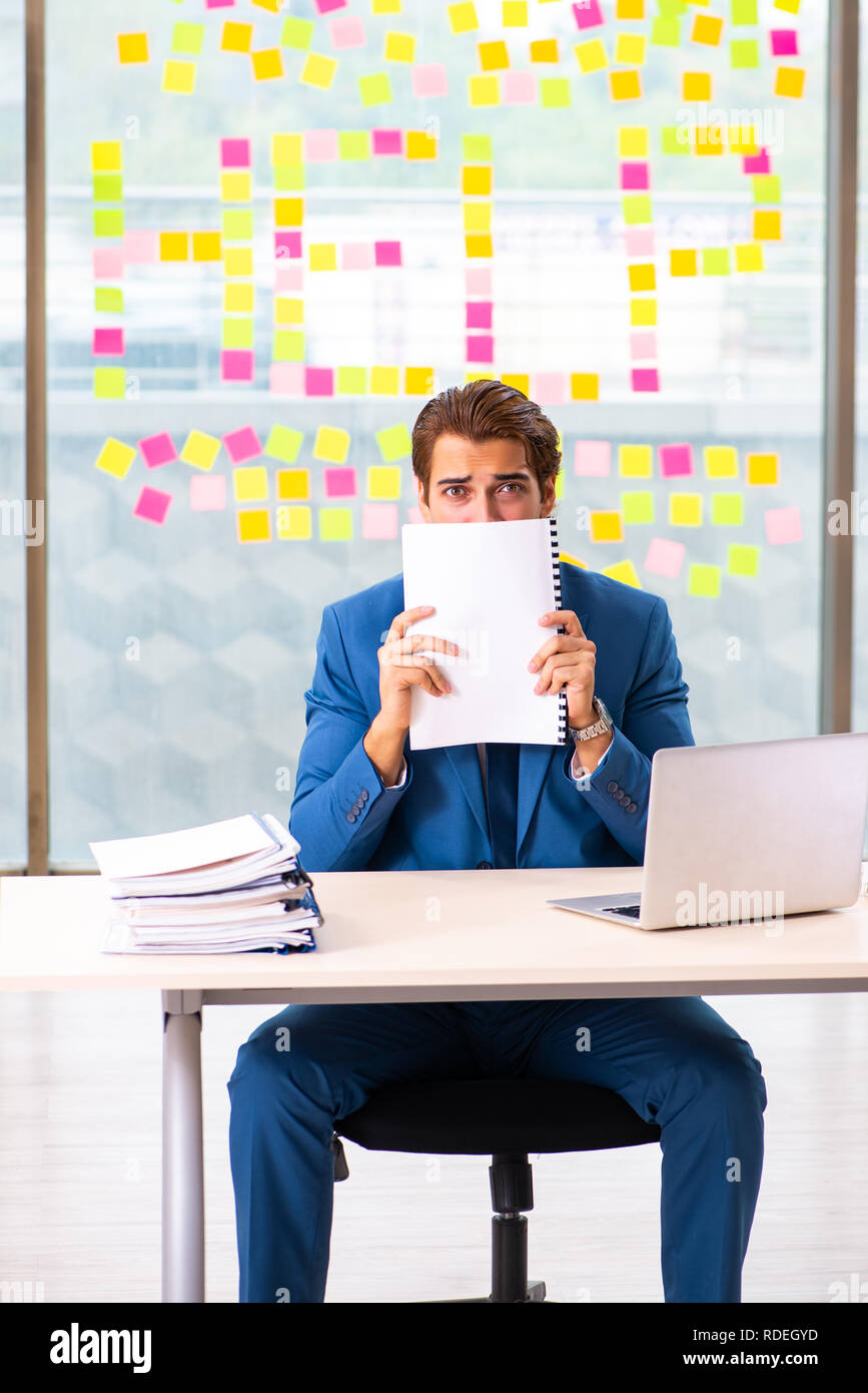 Busy businessman working in the office Stock Photo - Alamy