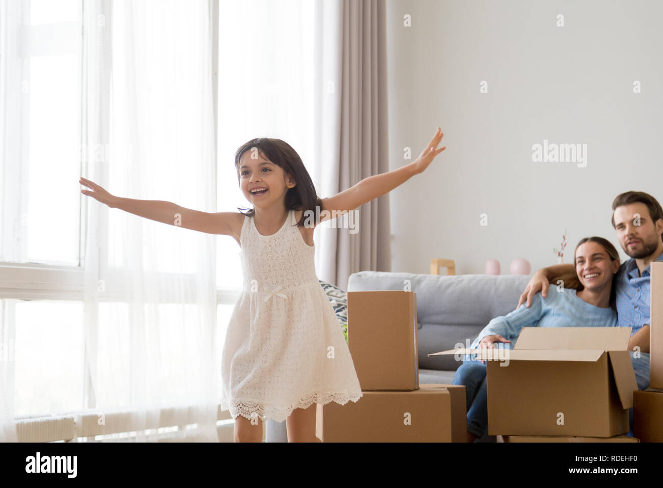 Cute kid feeling happy playing running on moving day concept Stock ...