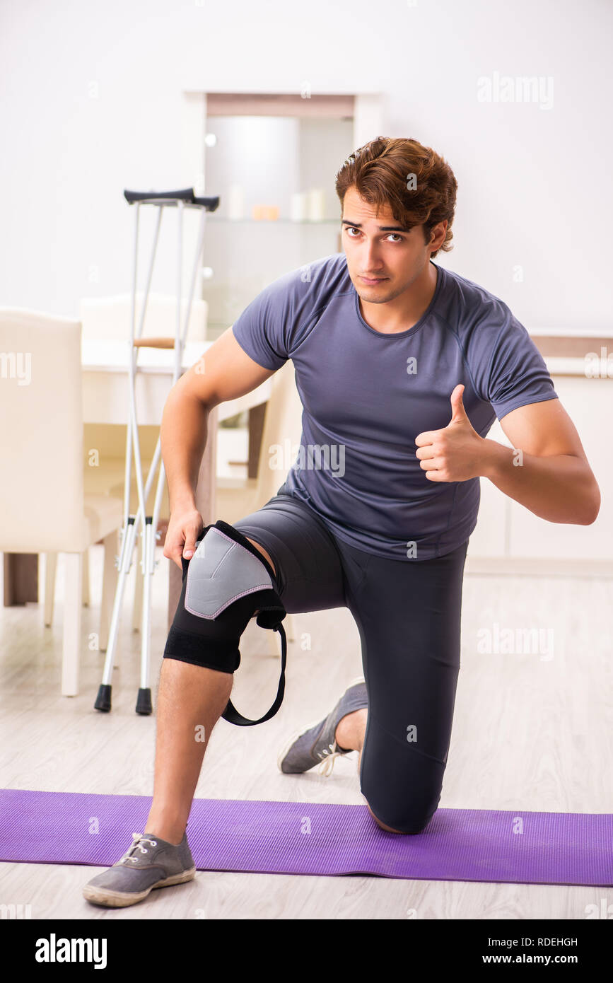 Man exercising for knee injury recovery Stock Photo - Alamy