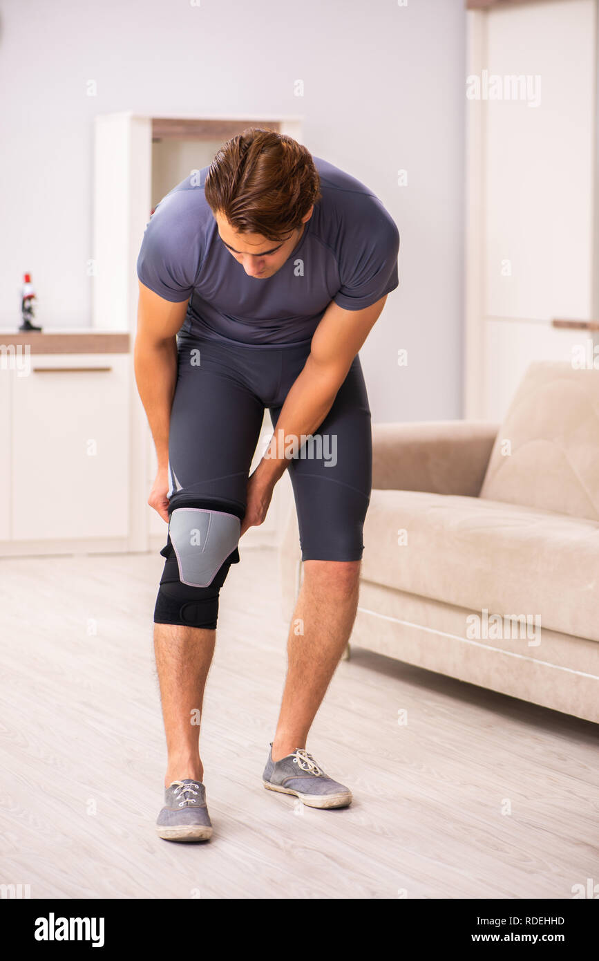 Man exercising for knee injury recovery Stock Photo - Alamy