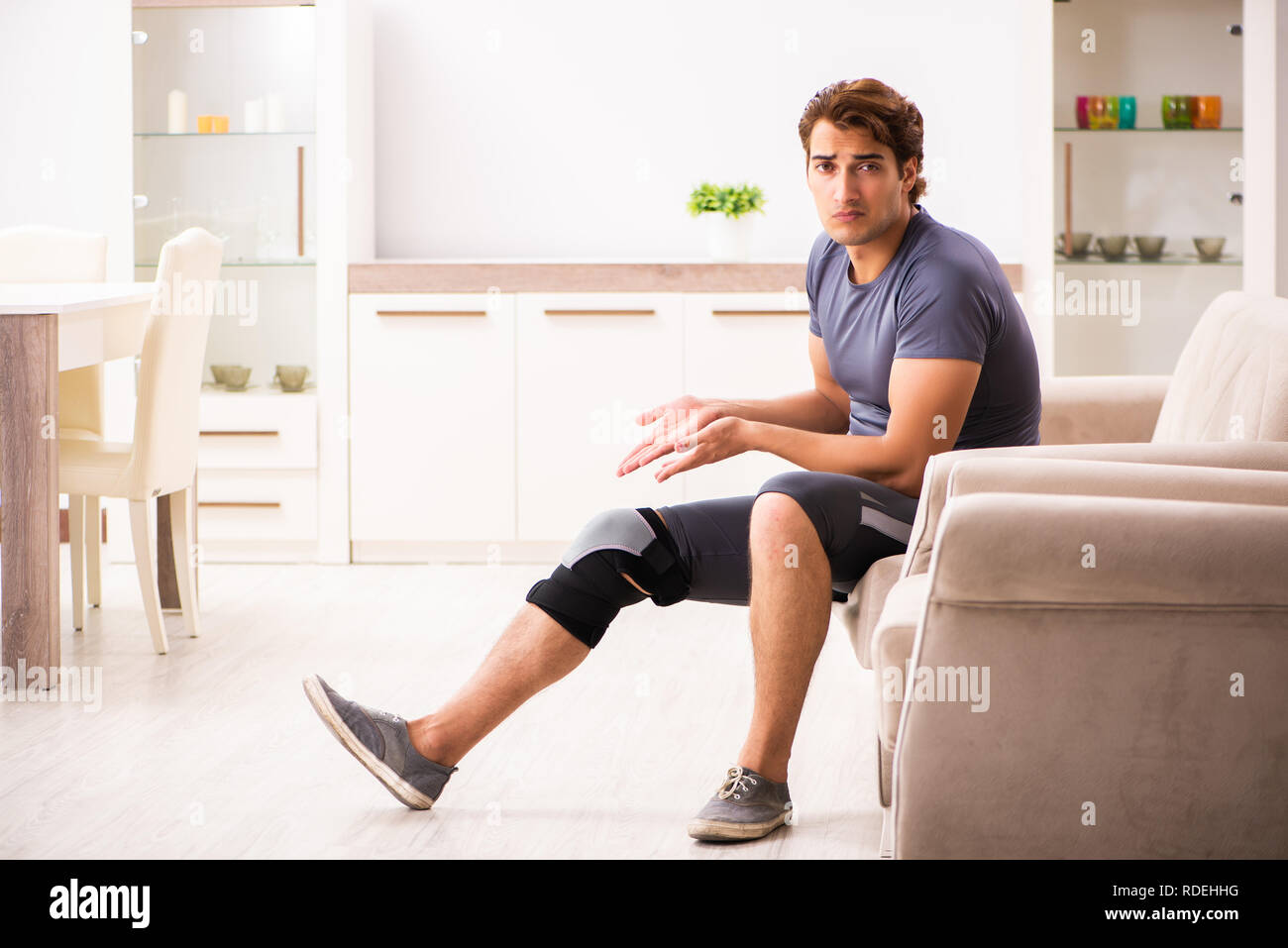 Man exercising for knee injury recovery Stock Photo - Alamy