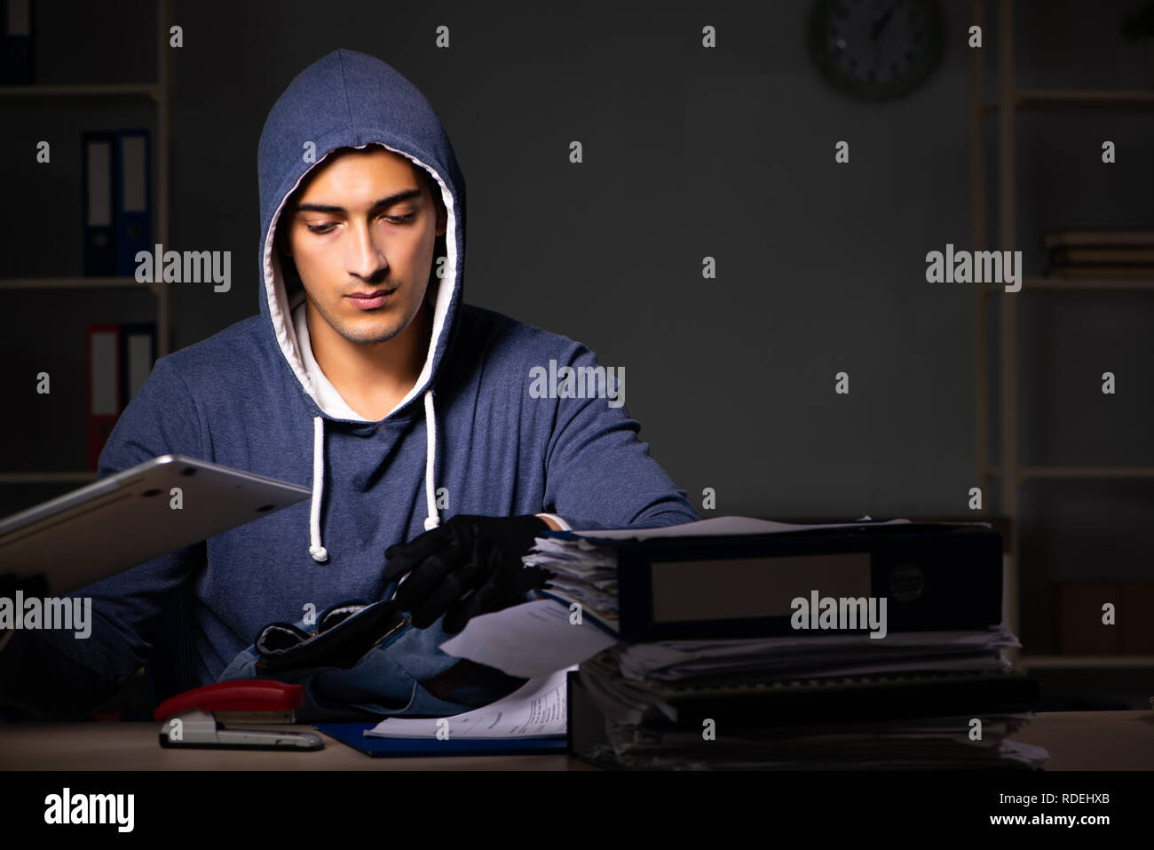 Thief trying to steal personal data in identity theft concept Stock ...