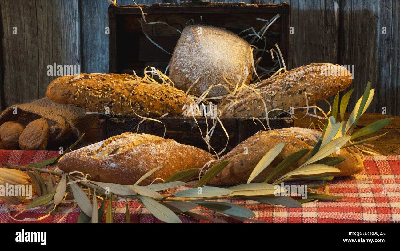 artisan breads in a treasure chest with wooden background Stock Photo ...