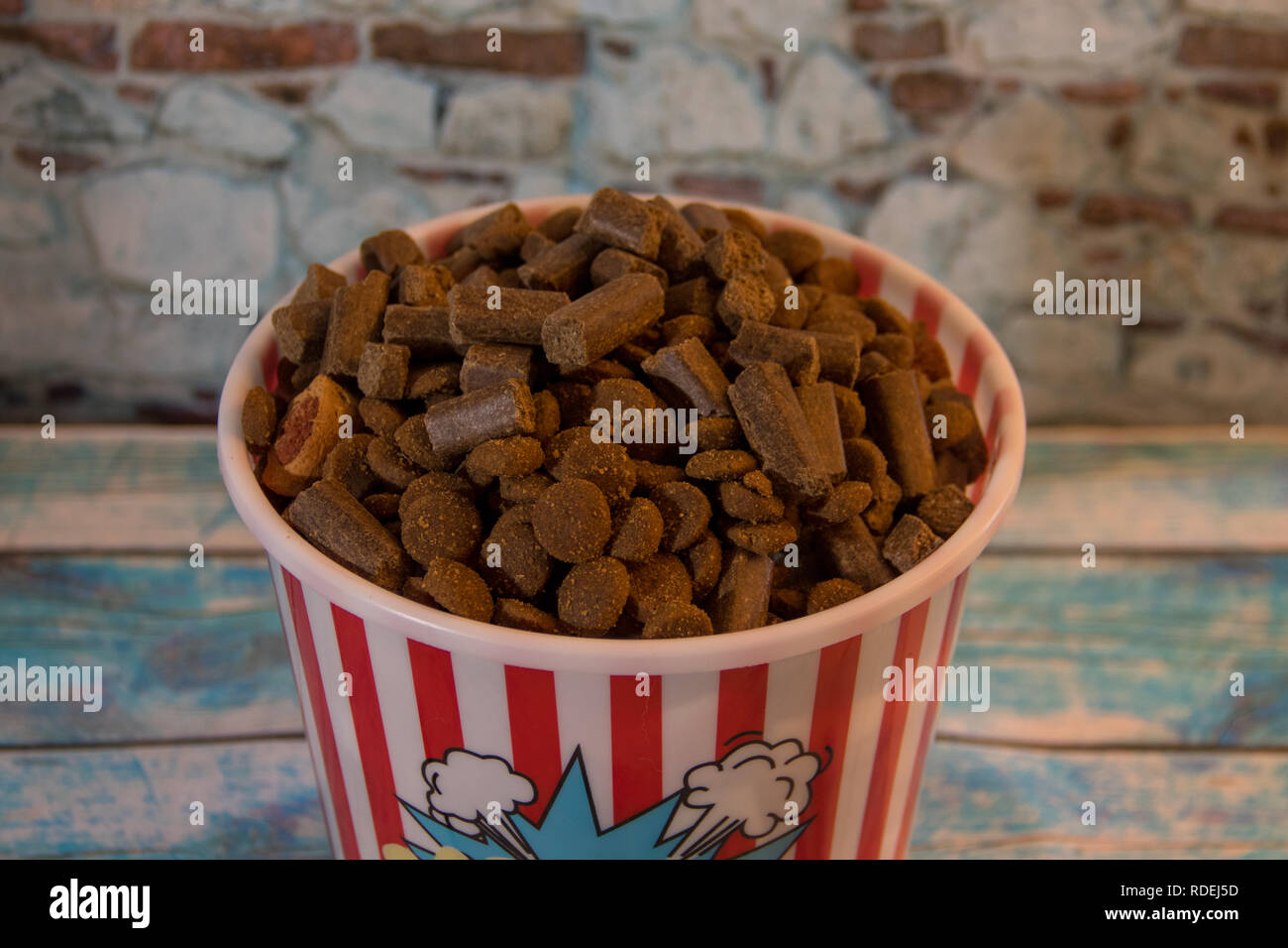 dog prizes in a container of popcorn Stock Photo - Alamy
