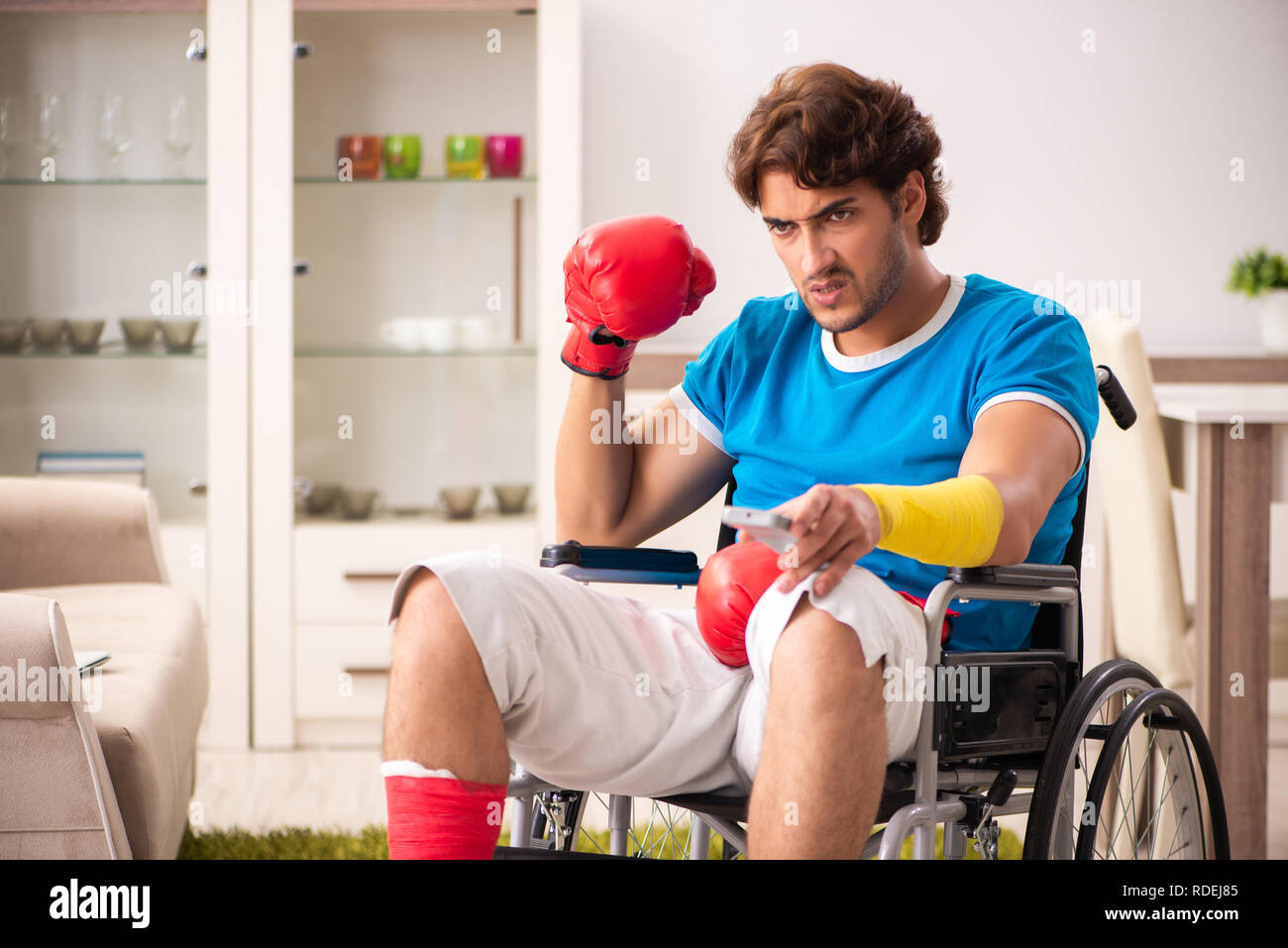 Injured man recovering from his injury Stock Photo - Alamy