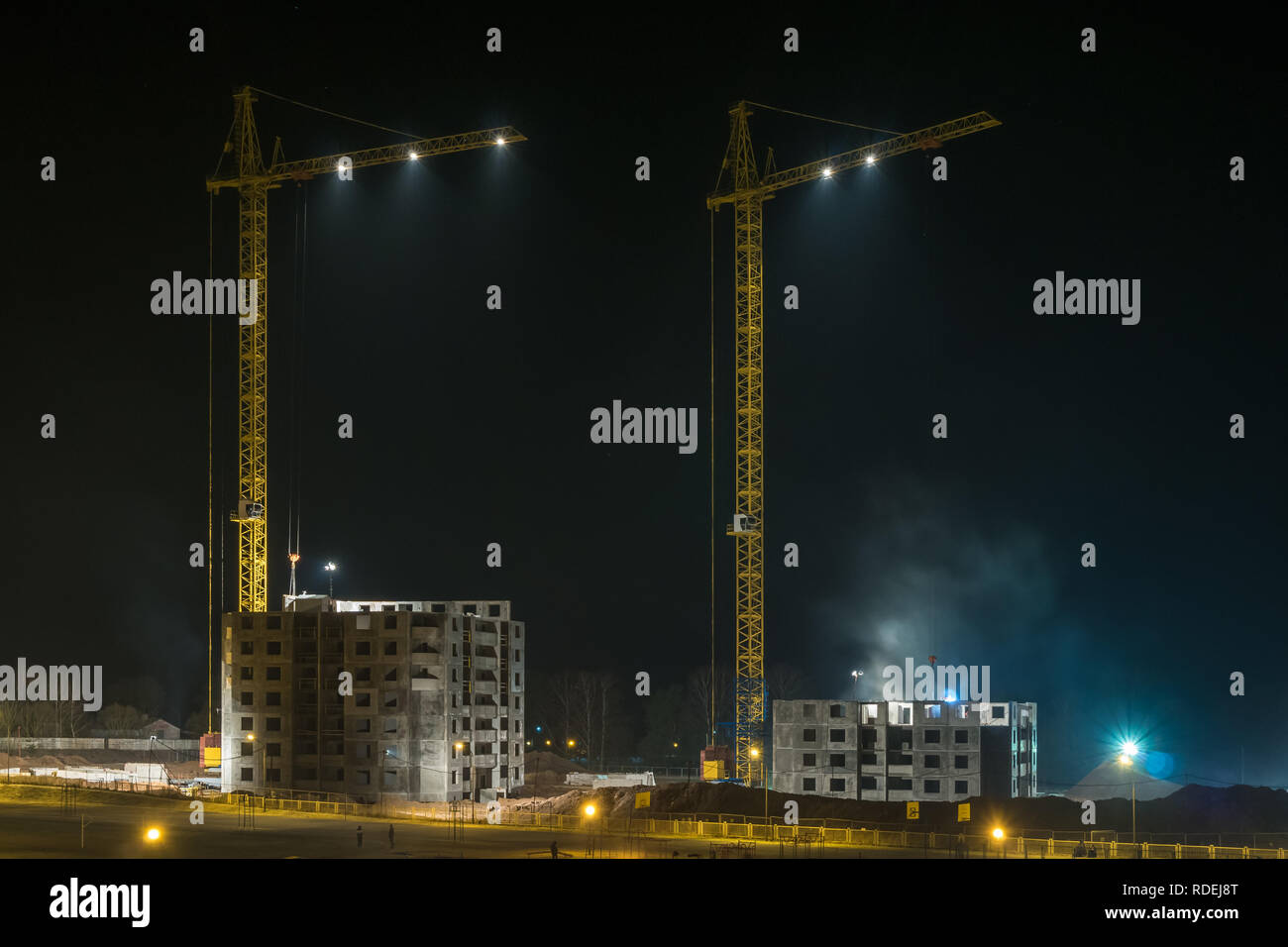 Tower cranes and unfinished multi-storey high buildings under ...