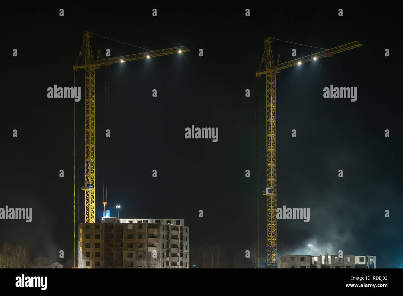 Tower cranes and unfinished multi-storey high buildings under ...