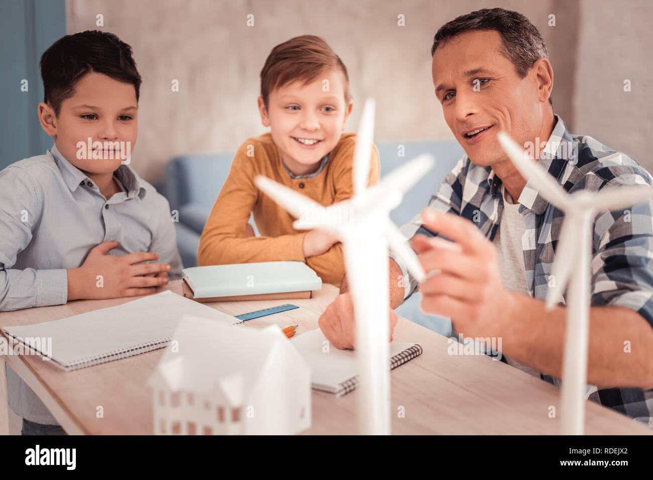 Smart tutor telling his pupils about windmills Stock Photo - Alamy