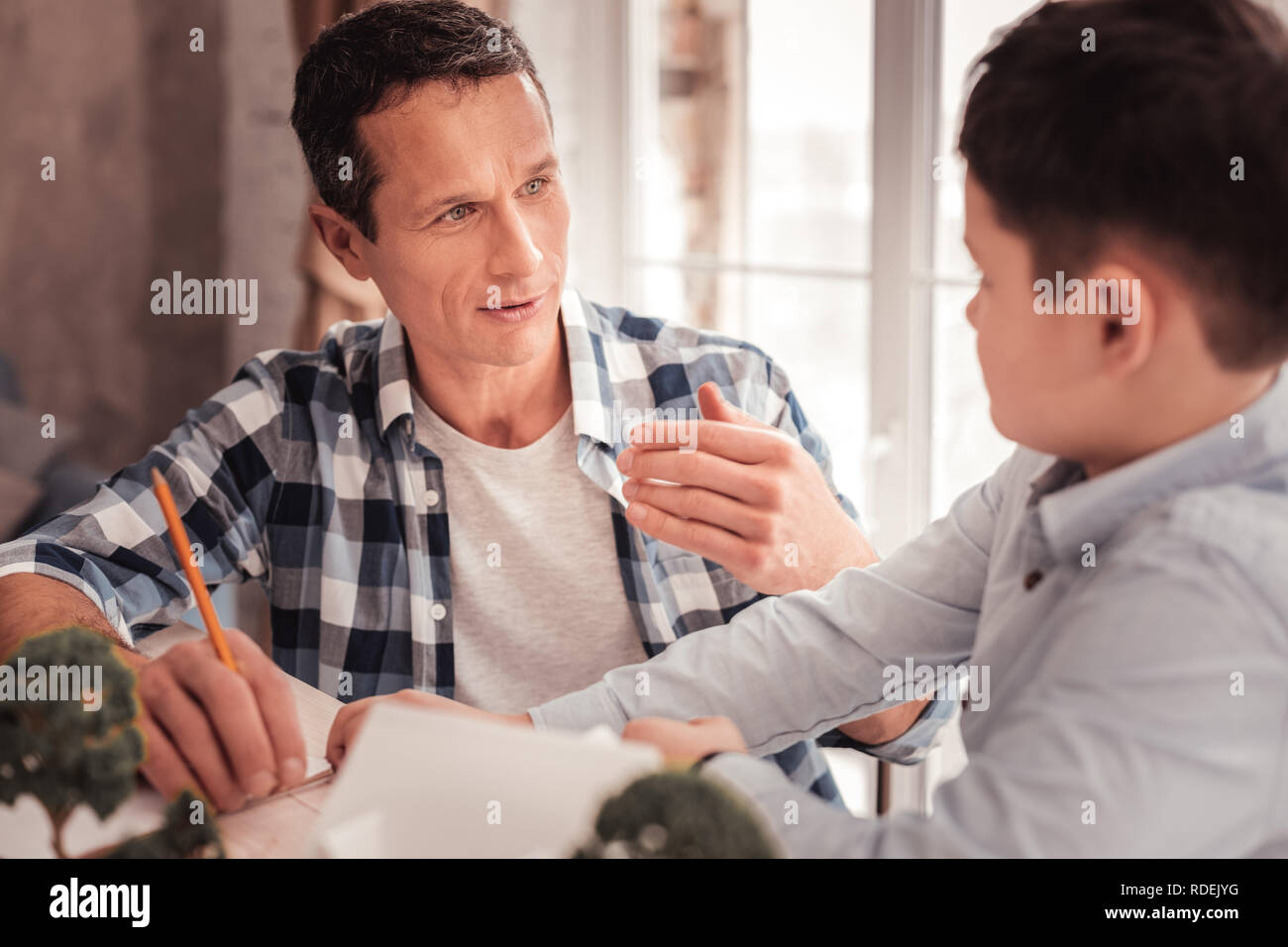 Foster father improving his interpersonal relations with his son Stock ...