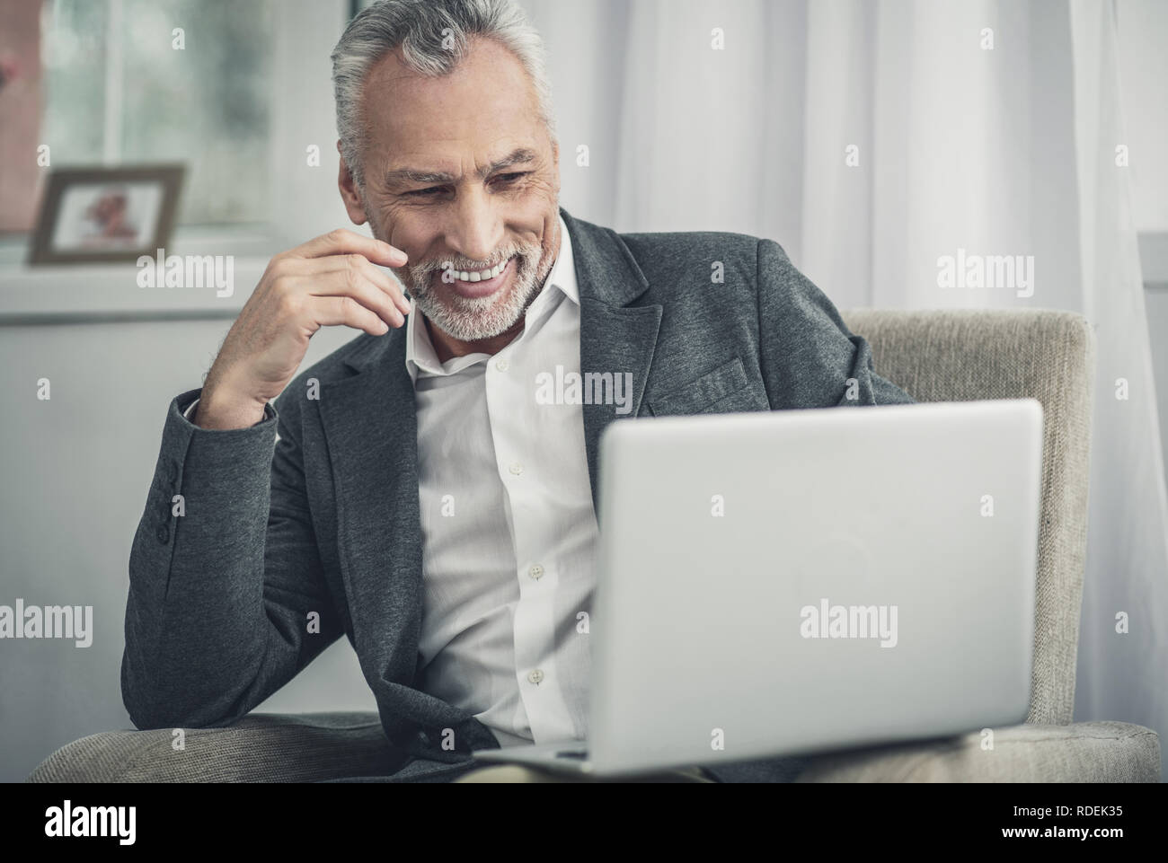 Busy businessman feeling cheerful having break Stock Photo - Alamy