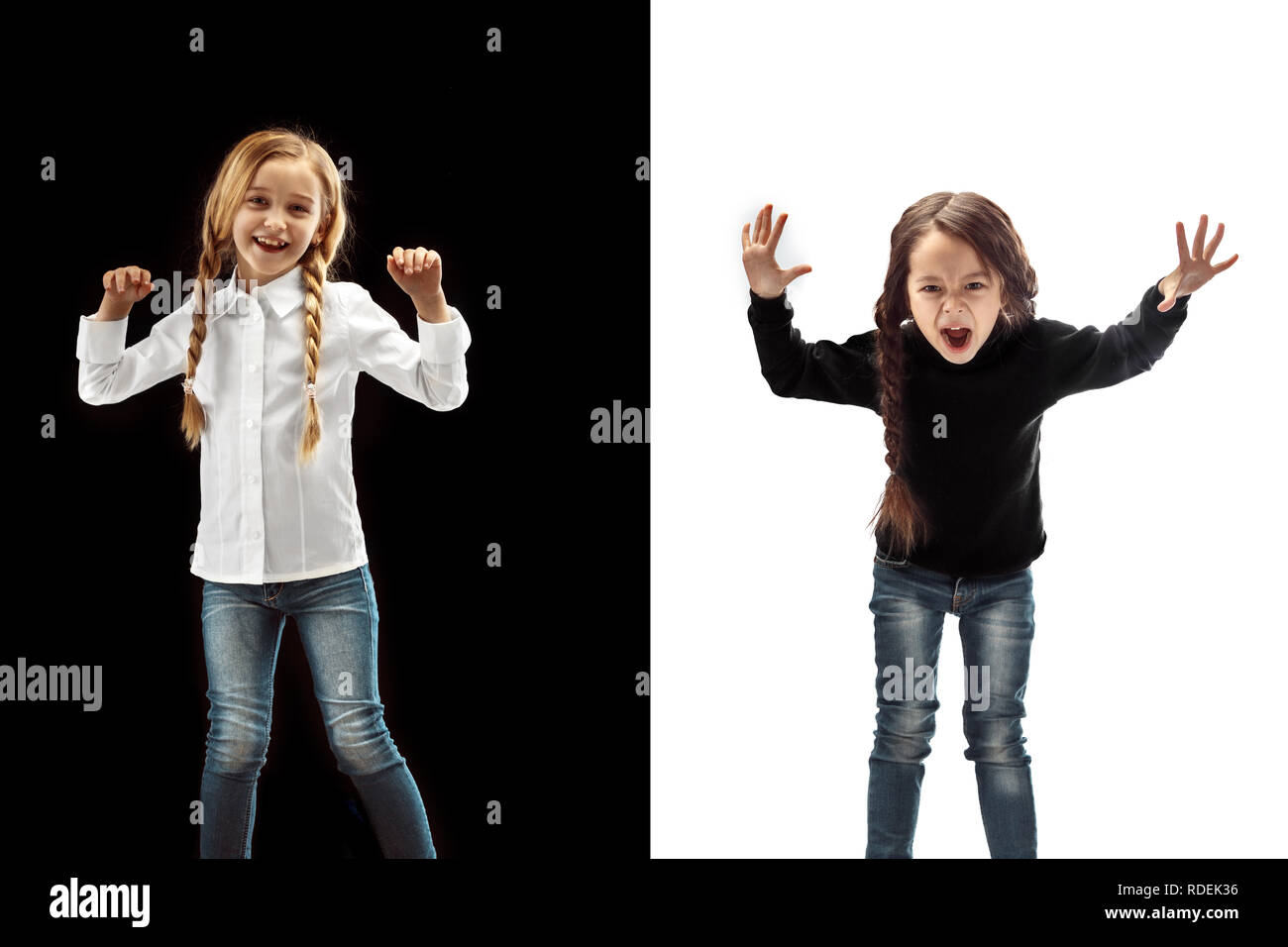 The portrait of emotional happy winner girl and serious angry girl on a ...