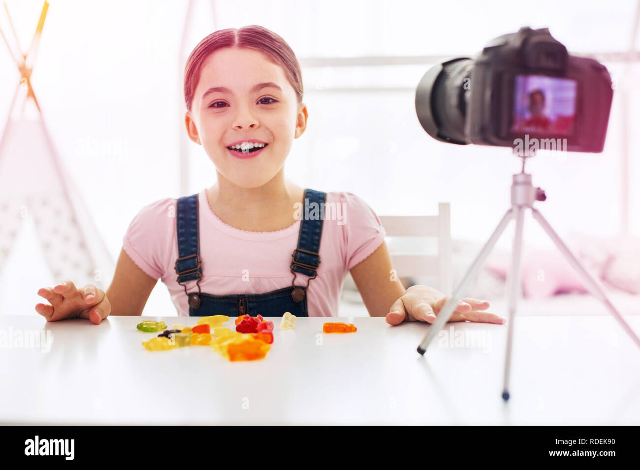 Little funny food blogger telling her followers about favorite sweets ...