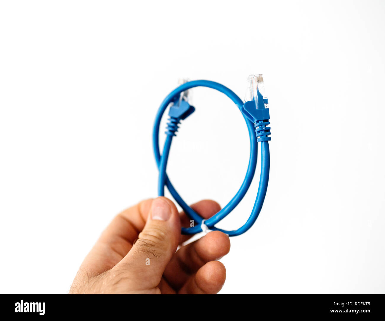 Man holding in hand against white background blue Ethernet internet ...