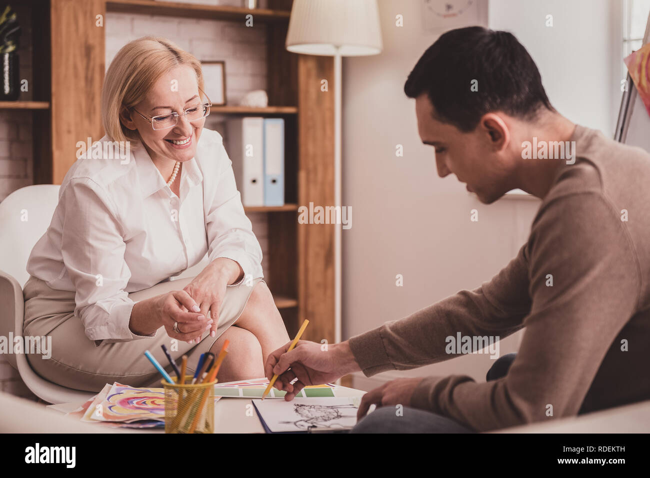 Kind female person keeping smile on her face Stock Photo - Alamy