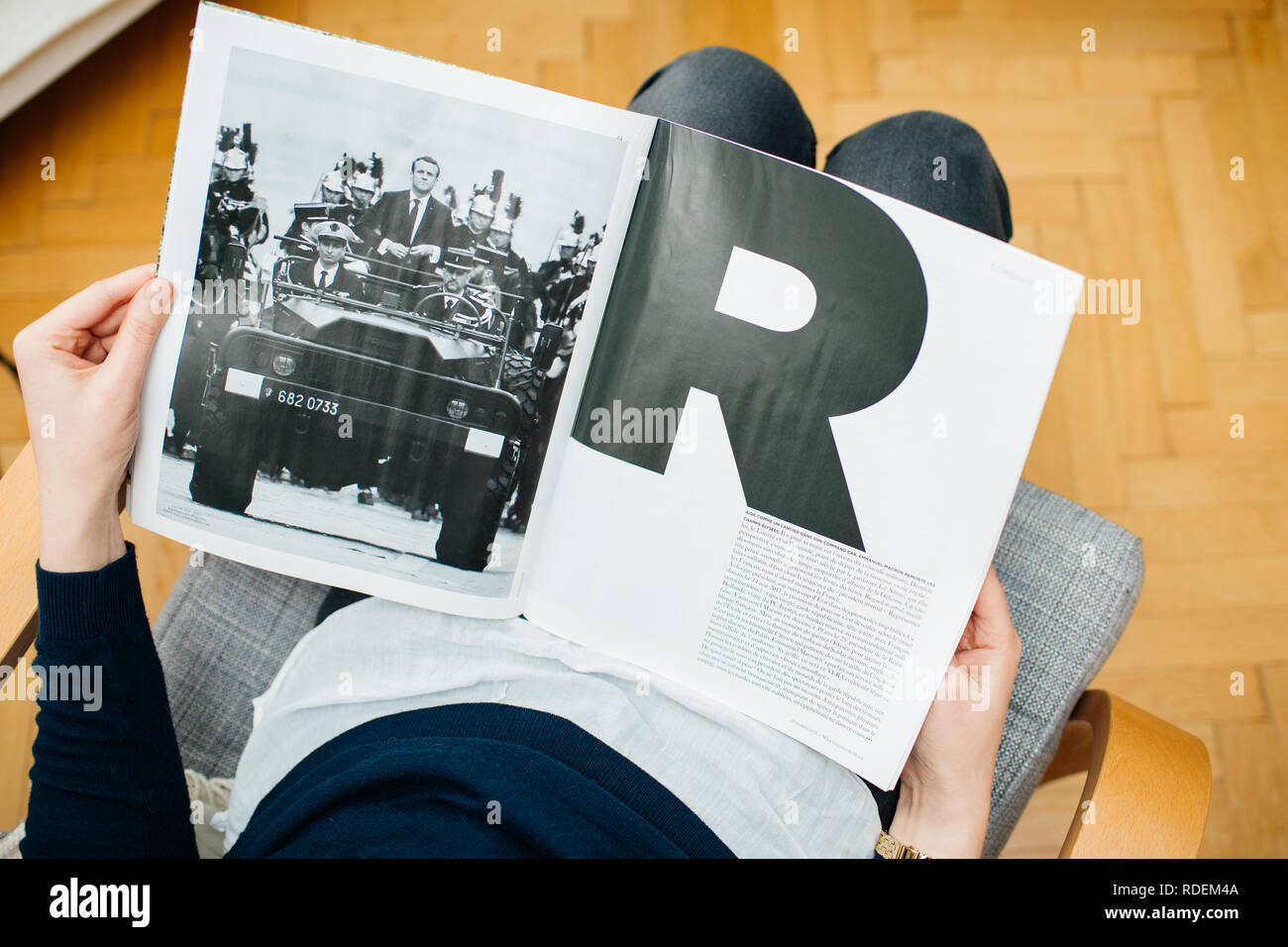 Paris, France - Jan 2, 2019: Woman reading article in M le magazine du ...