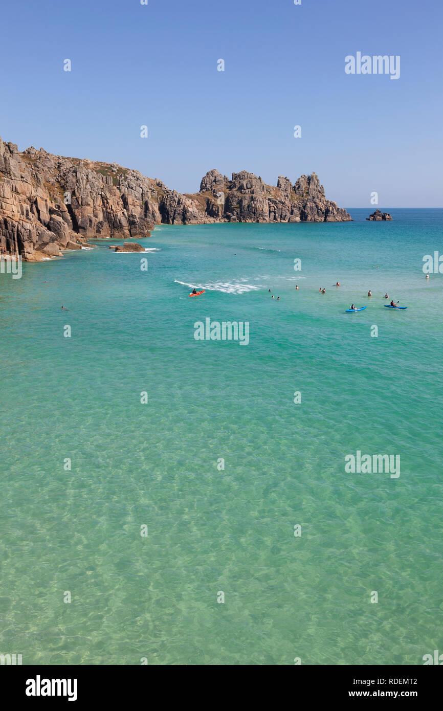 Crystal clear waters surround Logan's Rock in West Cornwall Stock Photo ...