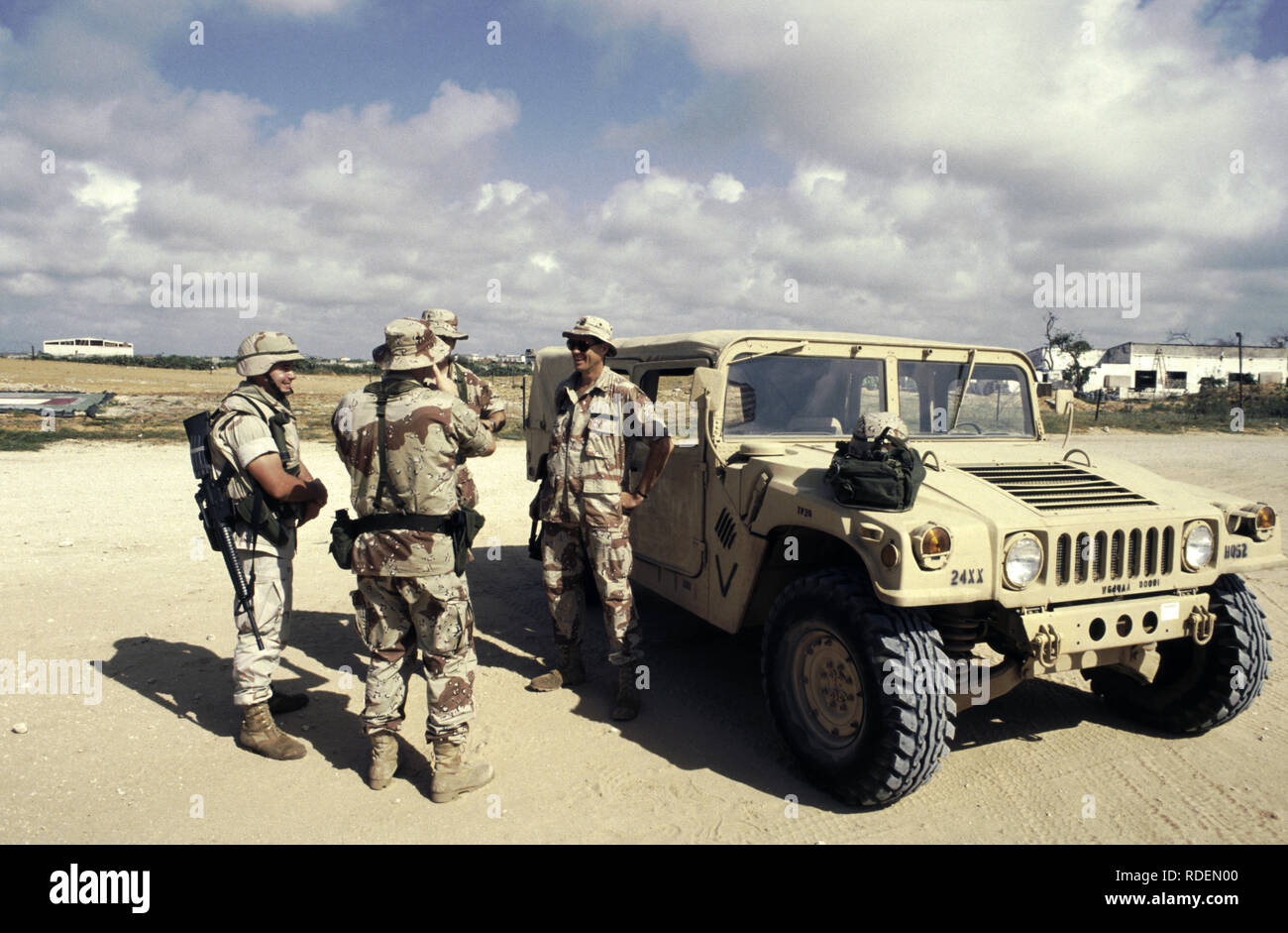 12th October 1993 A group of U.S. Army soldiers stand next to a Humvee ...