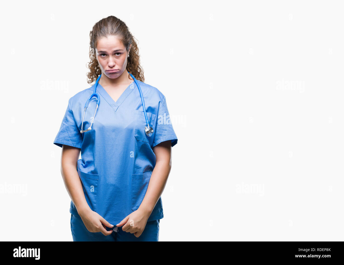 Young brunette doctor girl wearing nurse or surgeon uniform over ...