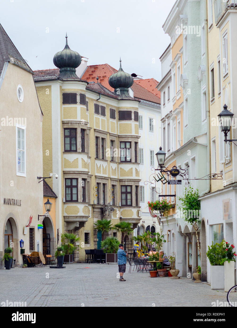 Small shops line the cobblestone streets in the old centre of Linz ...