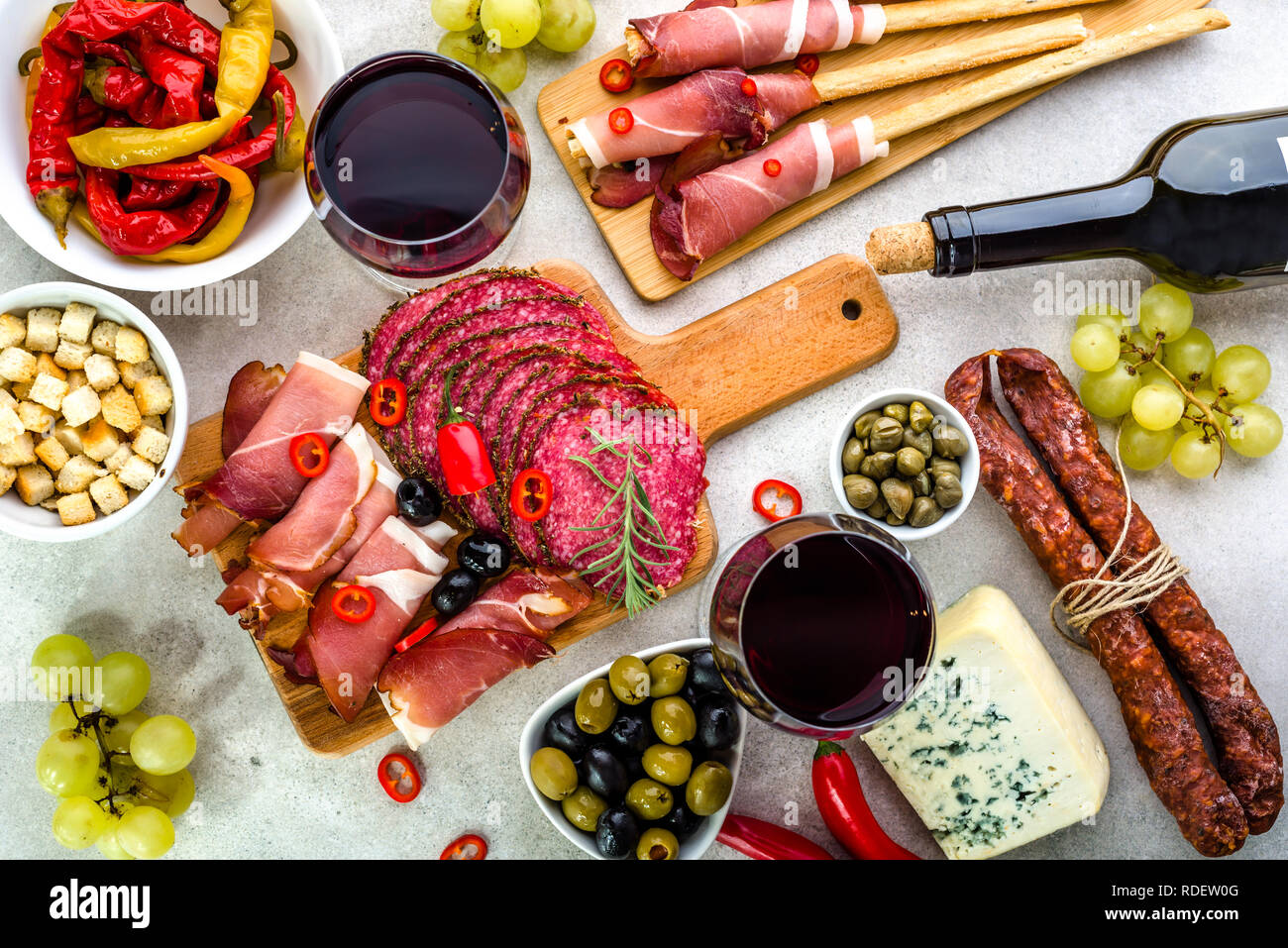 Table with food from spain, spicy tapas, cold meat, wine, chorizo and ...