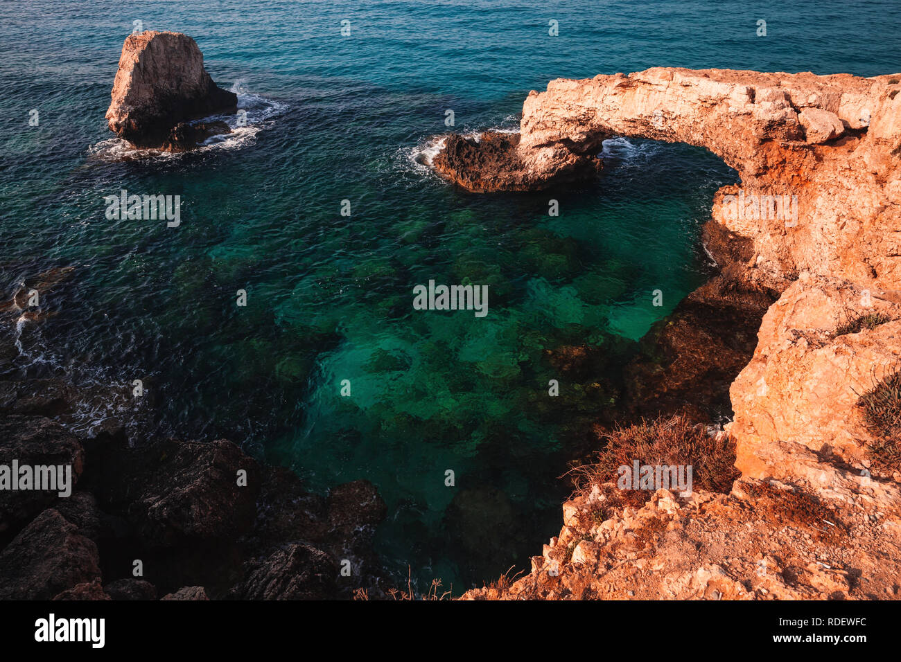 Natural stone arch known as the Love bridge. Mediterranean Sea coast ...