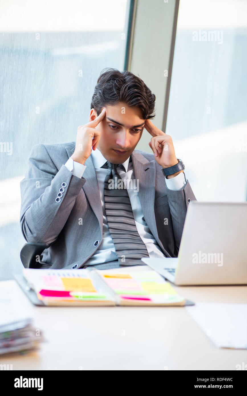 Young successful businessman working at the office Stock Photo - Alamy