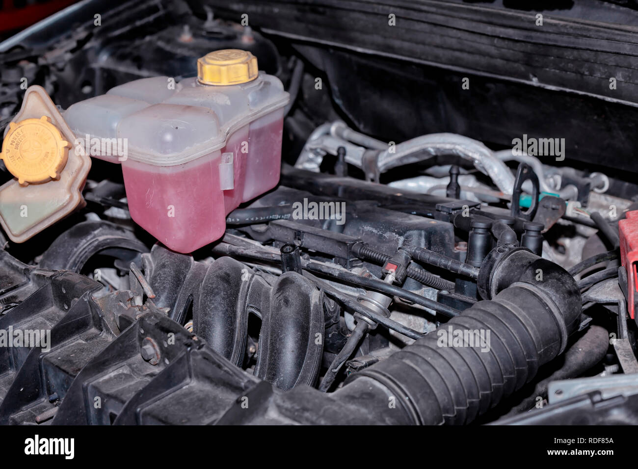The engine of a gasoline car that is being repaired in the workshop ...