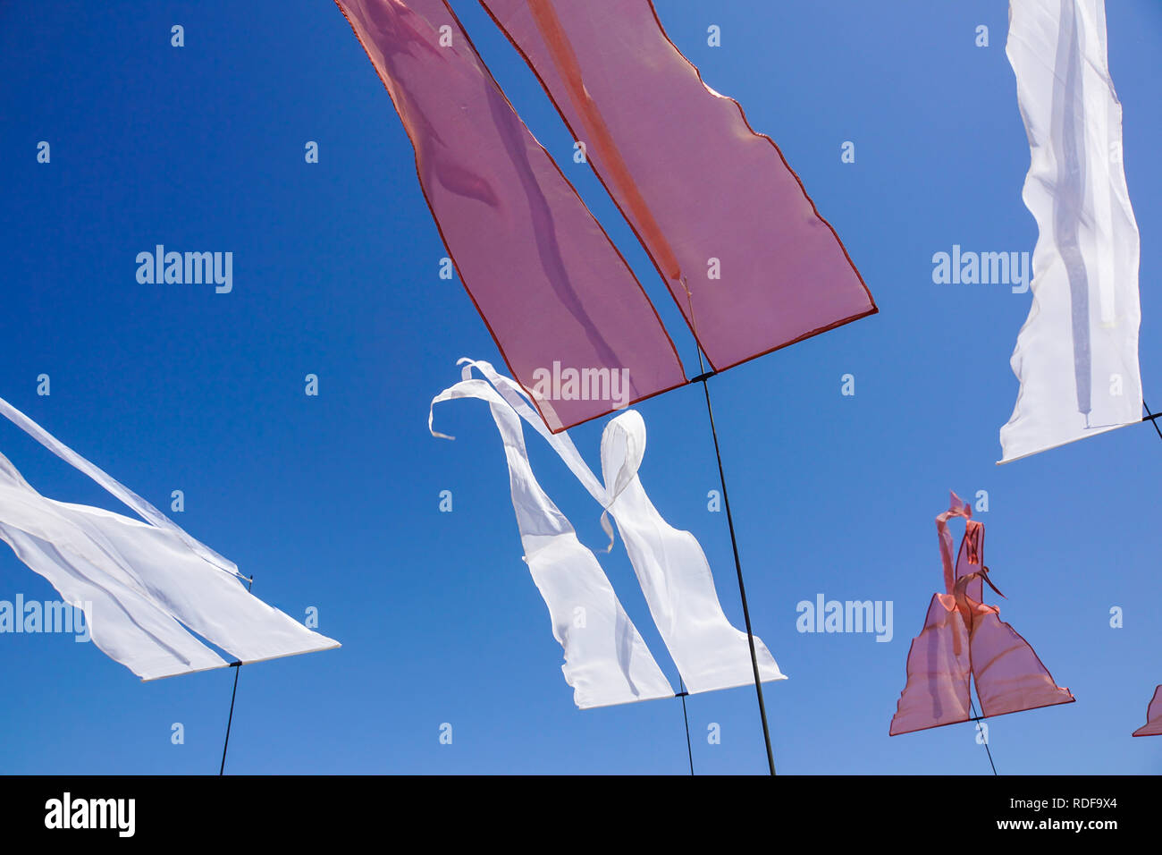 Beautiful kites in a kite festival. Blue sky Stock Photo - Alamy