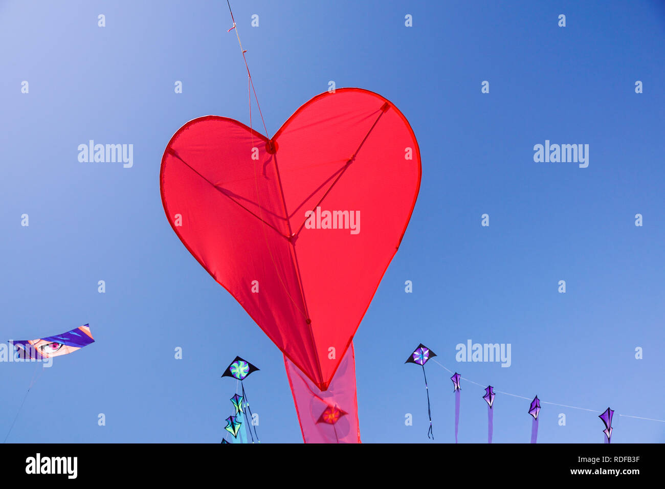 Red Heart Kite in a Blue Sky in fght Stock Photo - Alamy