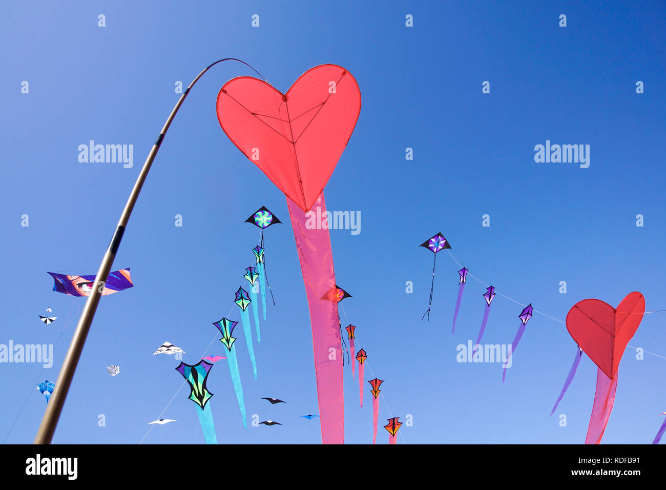 Red Heart Kite in a Blue Sky in fght Stock Photo - Alamy