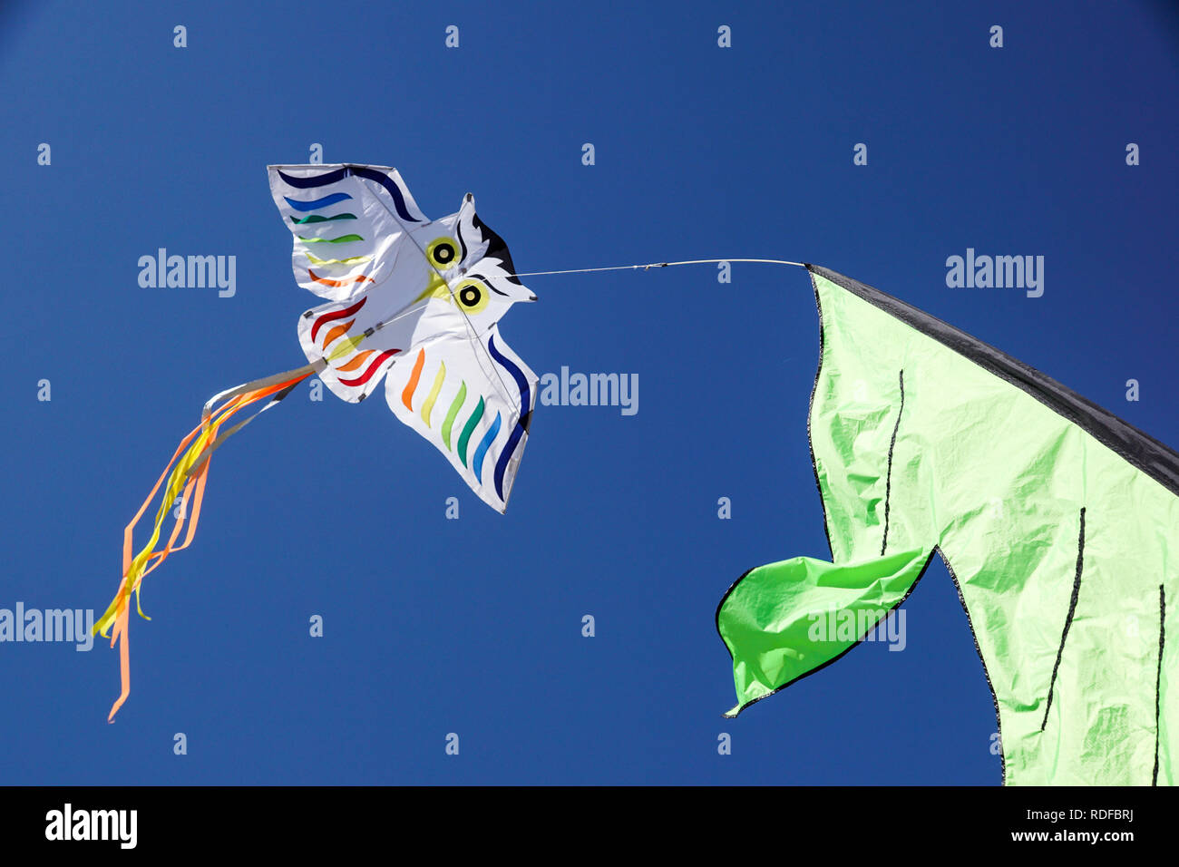 Beautiful kites in a kite festival. Blue sky Stock Photo - Alamy