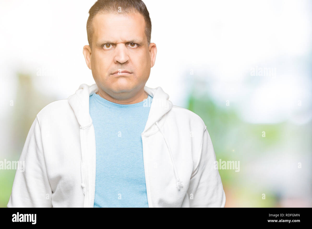 Middle age arab man wearing sweatshirt over isolated background skeptic ...