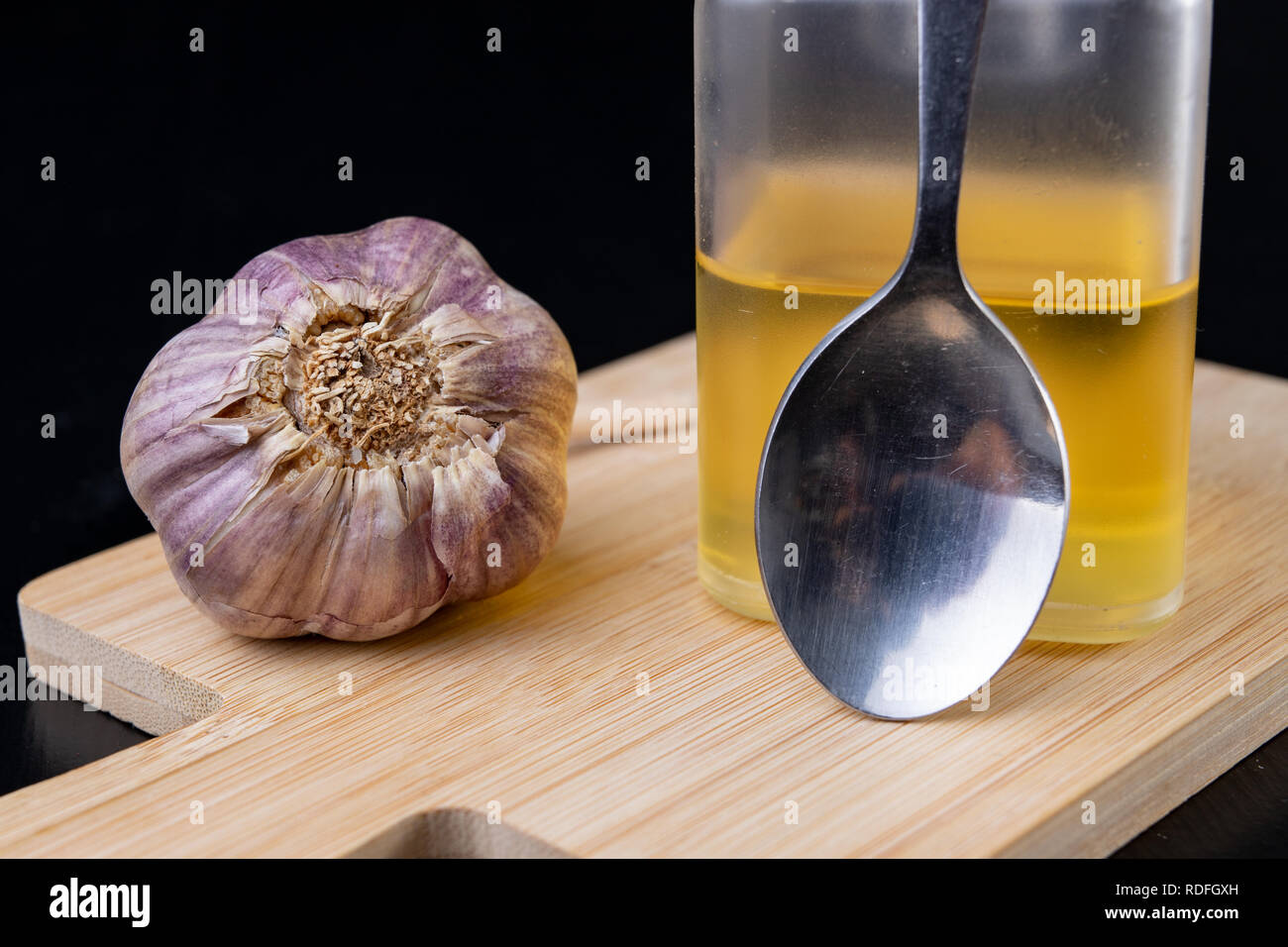 Garlic and medicinal juice for colds. Home remedies for colds. Dark ...
