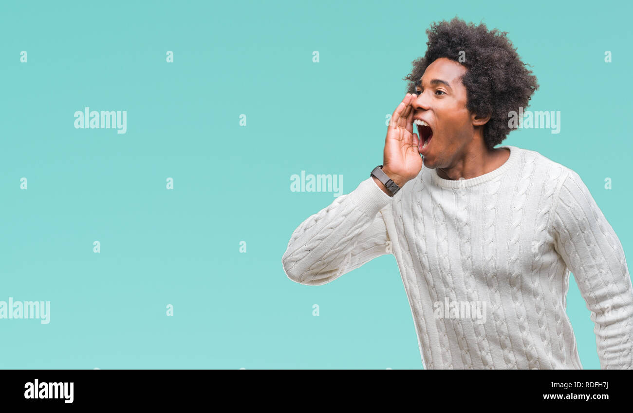 Afro american man over isolated background shouting and screaming loud ...