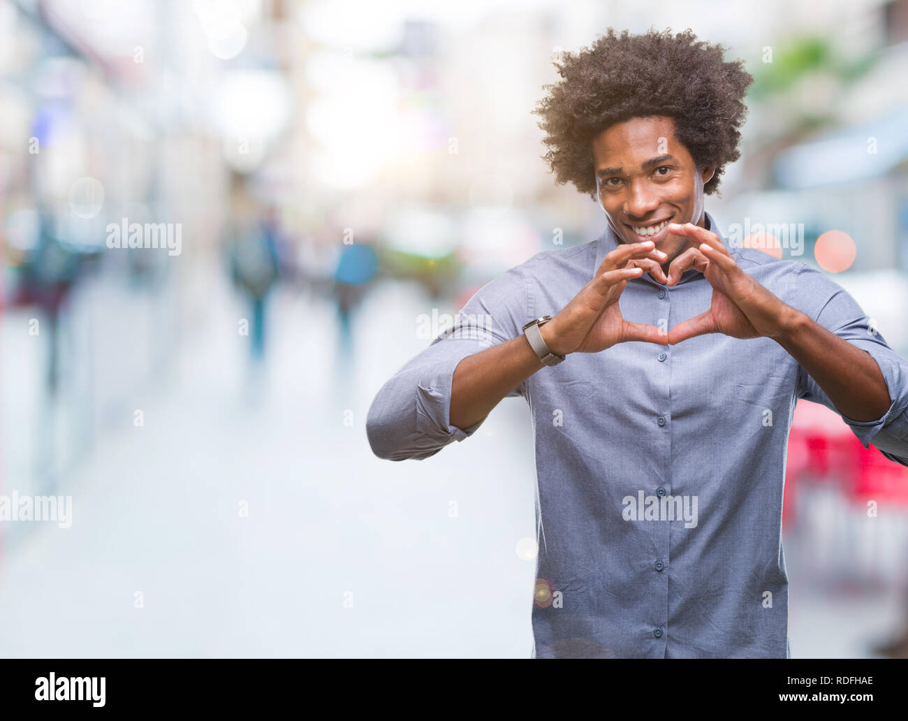Afro american man over isolated background smiling in love showing ...