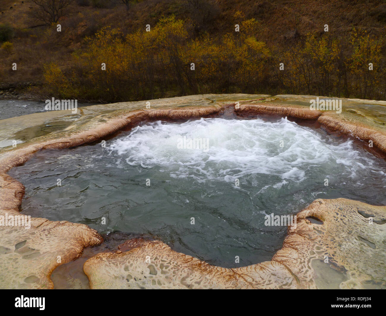 Colorful natural thermal hot spring. Texture and natural colors of a ...