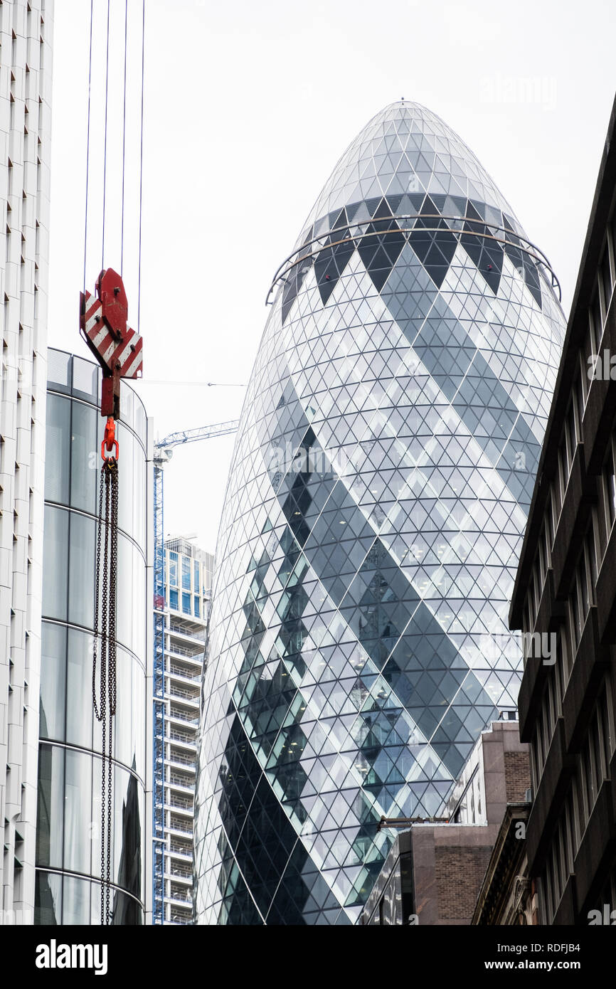 30st Mary Axe Building London with a Crane Stock Photo - Alamy
