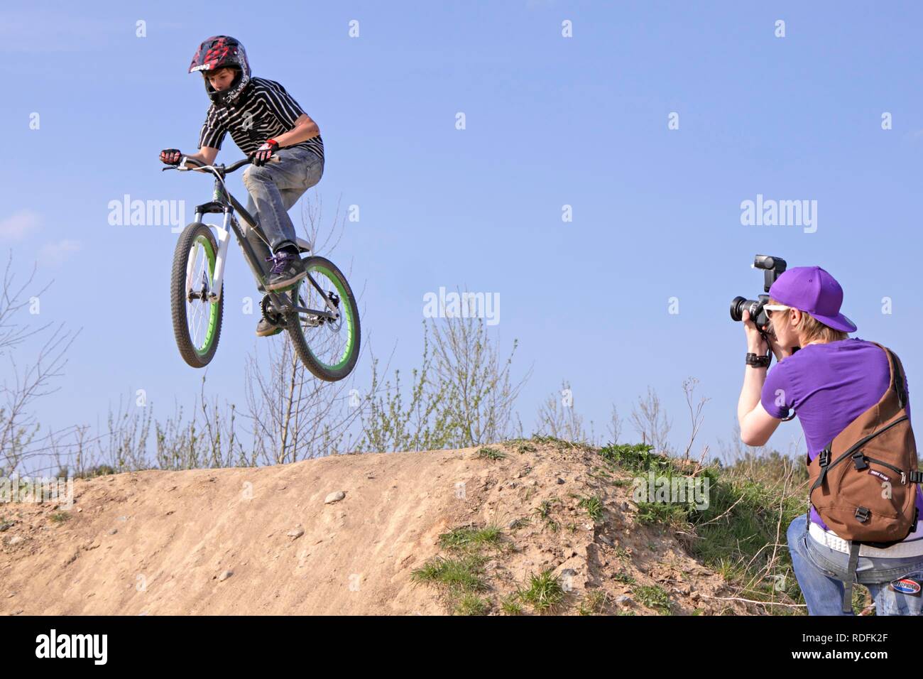 Boys jumping with bikes hi-res stock photography and images - Alamy