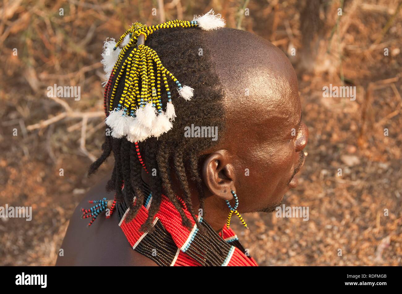 Portrait of a Hamar man with necklaces, earrings and dreadlocks, Omo ...