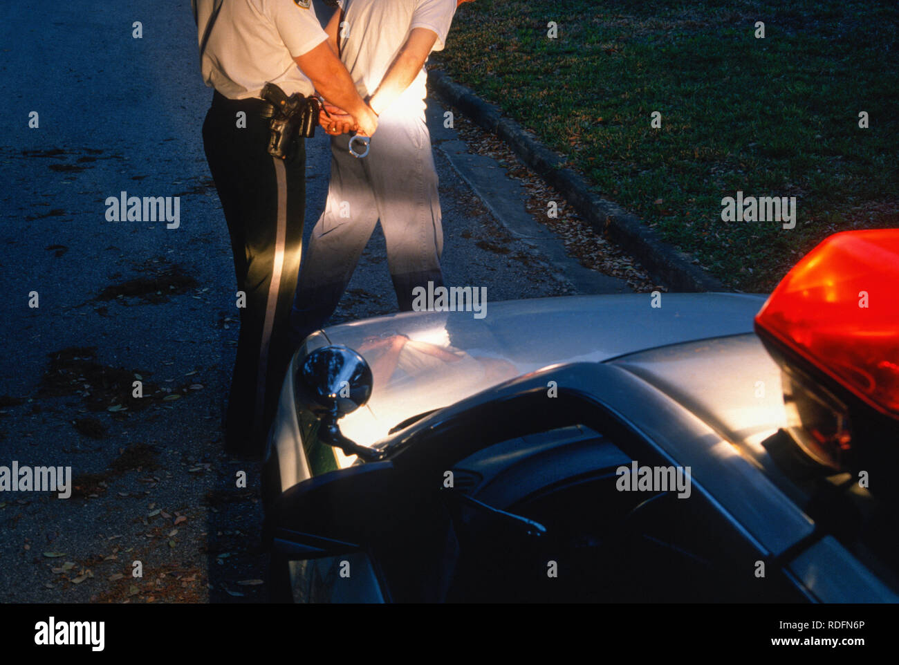 Handcuffing Suspect High Resolution Stock Photography and Images - Alamy